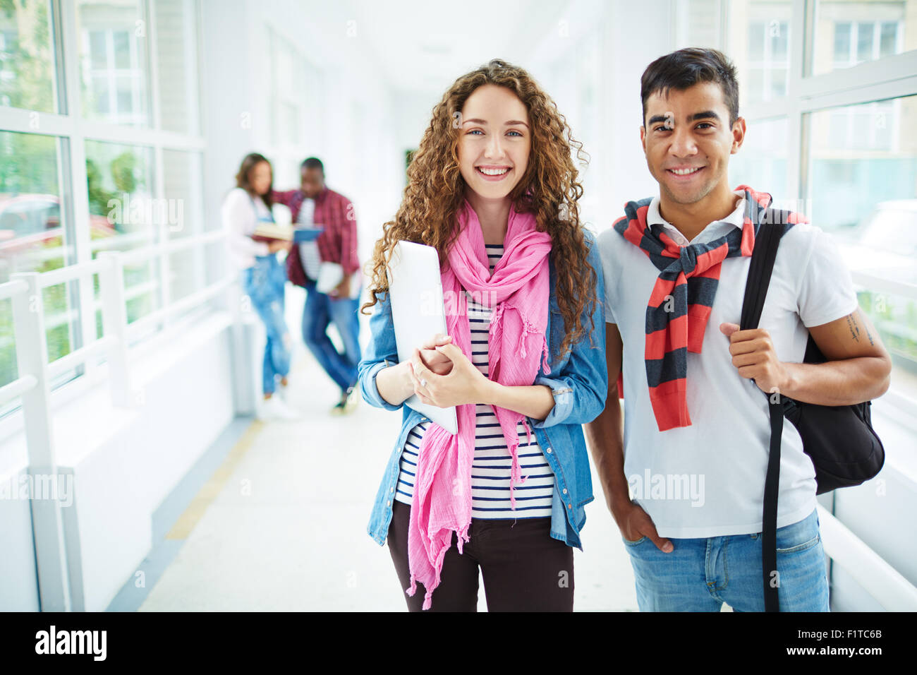 Multi-ethnic high school learners looking at camera in college Stock Photo - Alamy