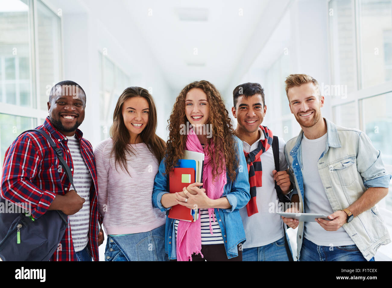 Group of friendly learners looking at camera in college Stock Photo - Alamy
