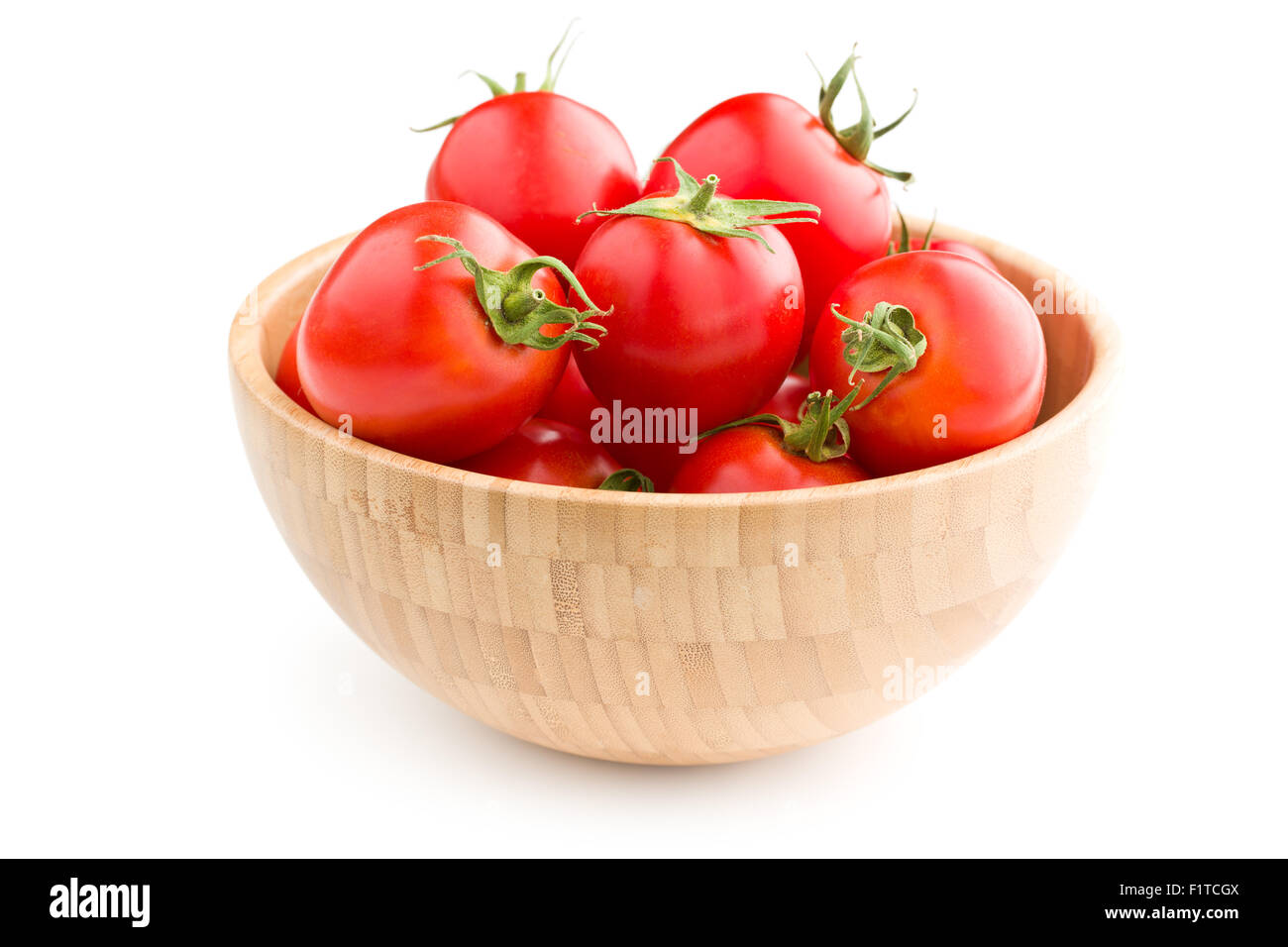 Red ripe tomatoes in wooden Cut Out Stock Images & Pictures - Alamy