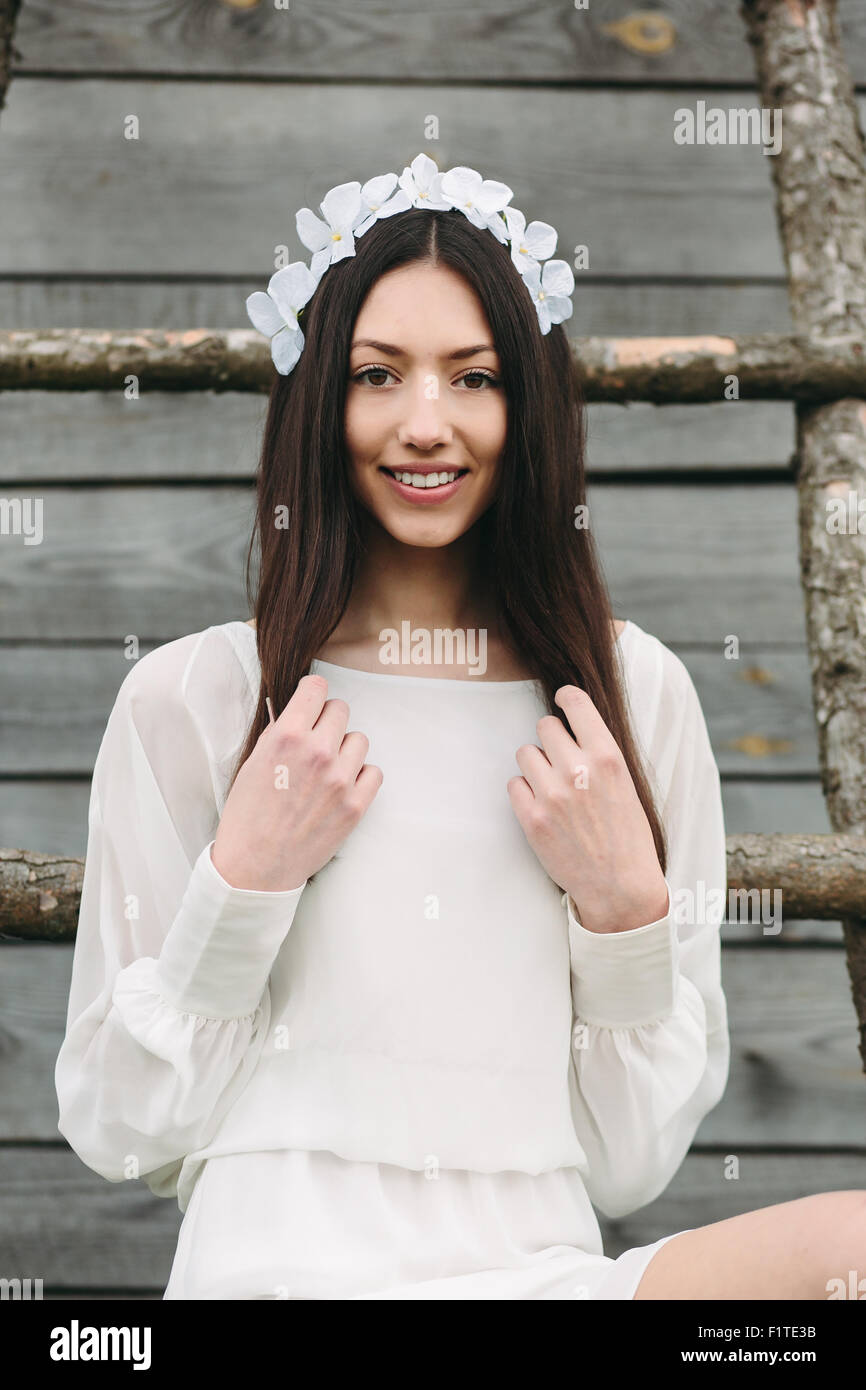 Girl climbing ladder into tree house Stock Photo - Alamy