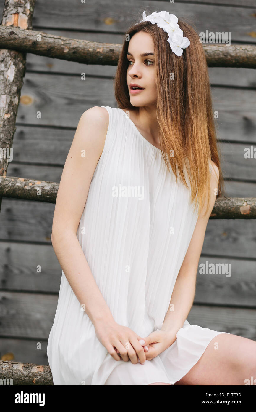 Girl climbing ladder into tree house Stock Photo - Alamy