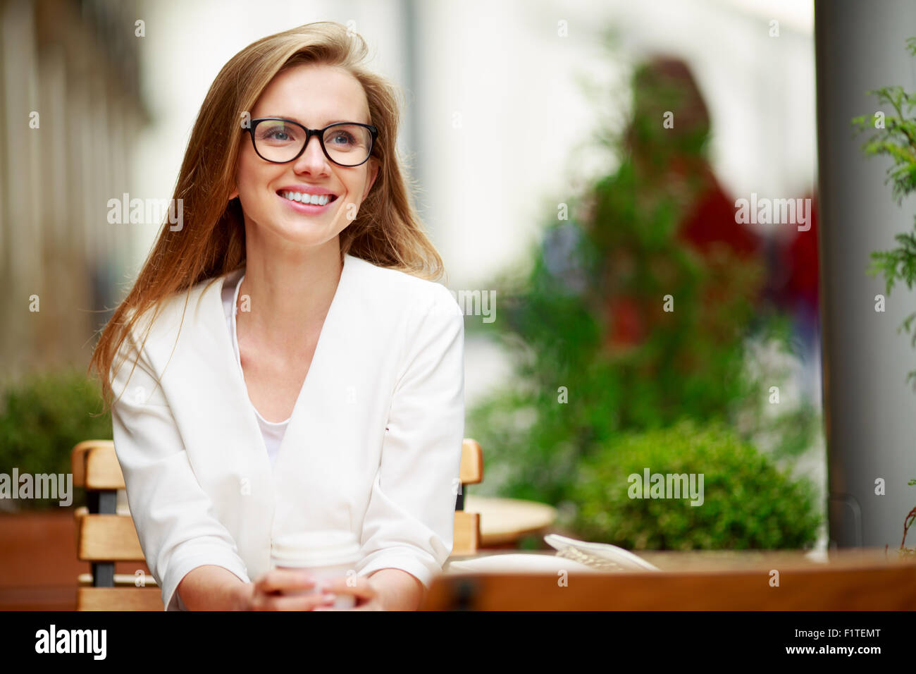 Portrait of a smiling business woman Stock Photo - Alamy