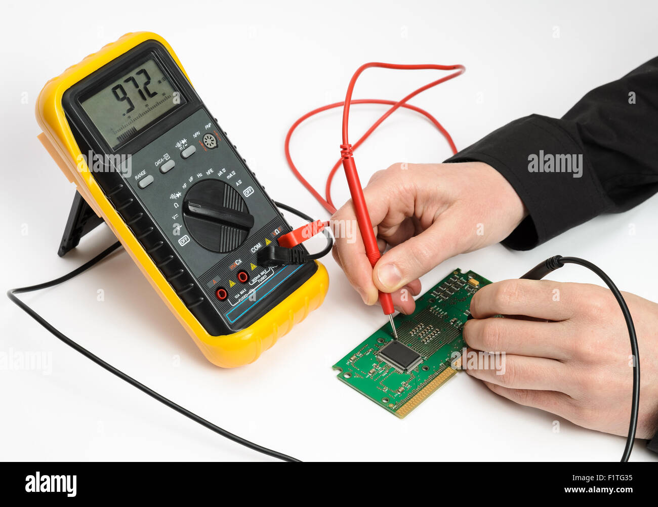 Testing electronic device. Measuring by multimeter Stock Photo - Alamy