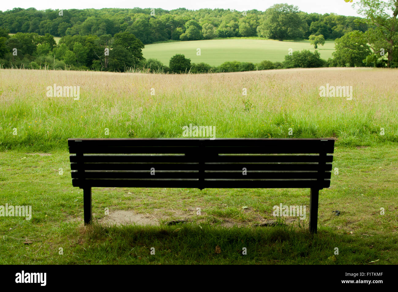 Elevated view of park bench with a view over fields Stock Photo - Alamy