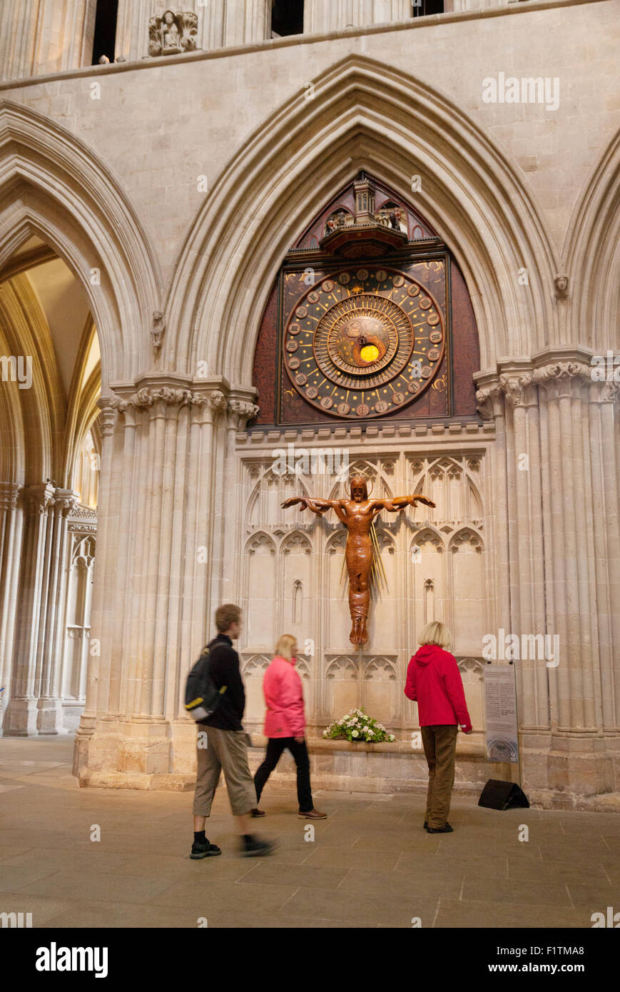 Visitors looking at the 14th century medieval Wells cathedral Clock ...