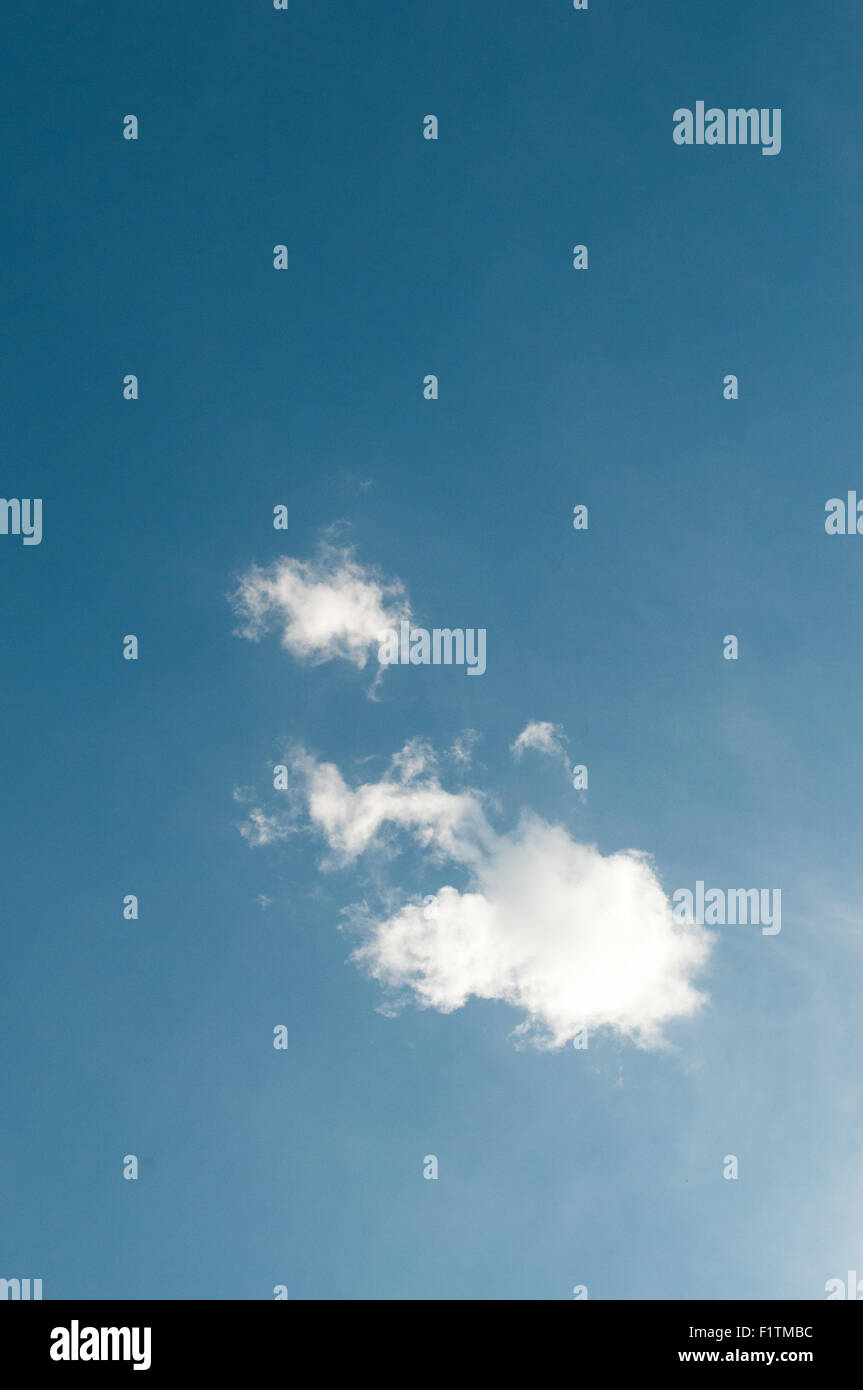 Single white cloud in blue sky Stock Photo - Alamy