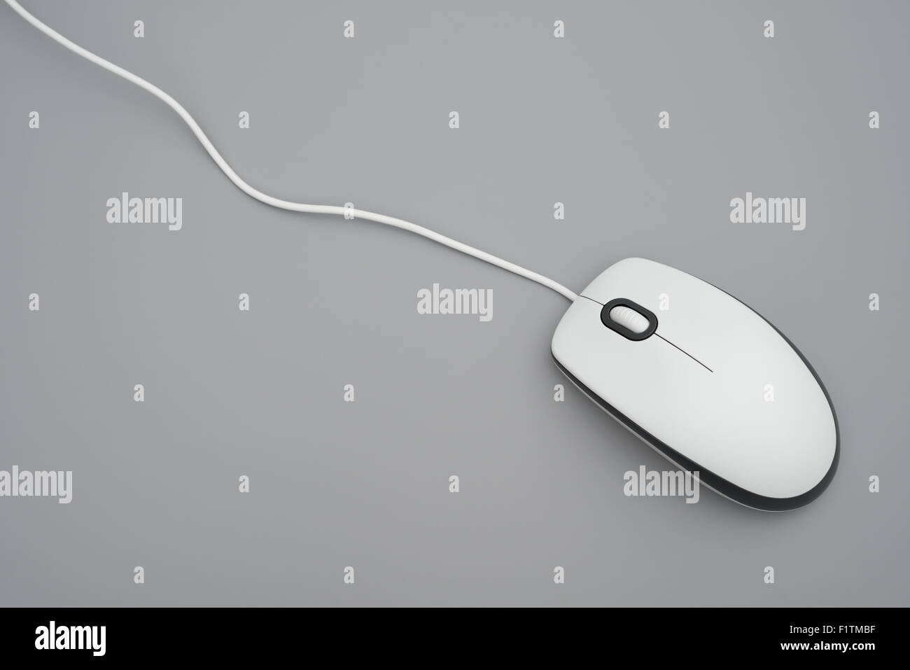white mouse on a grey background Stock Photo - Alamy