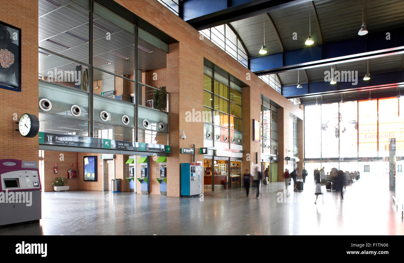 Railway station entrance with people and ticket machine Stock Photo - Alamy