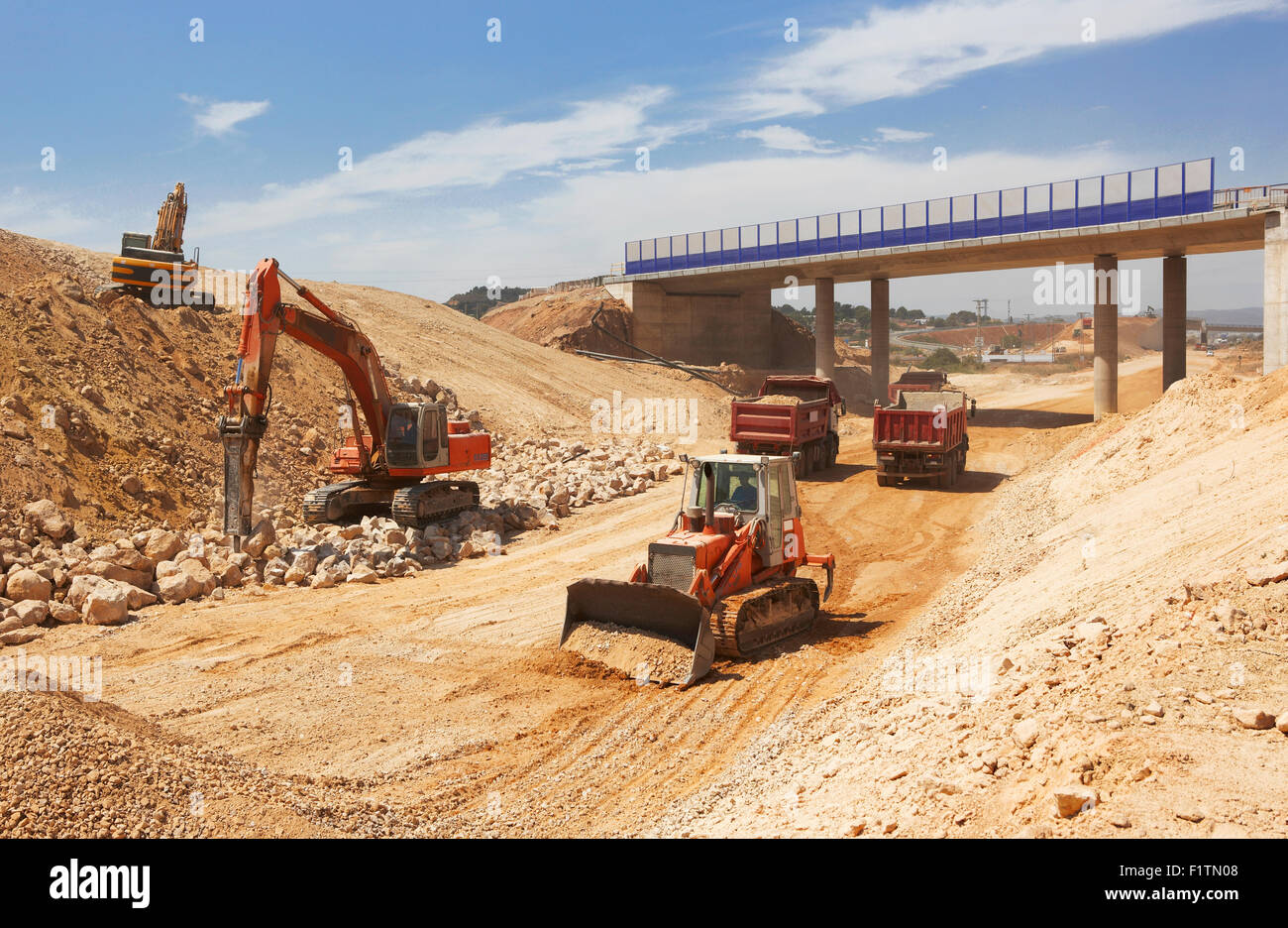 High speed line under construction with trucks, tractors and towing ...