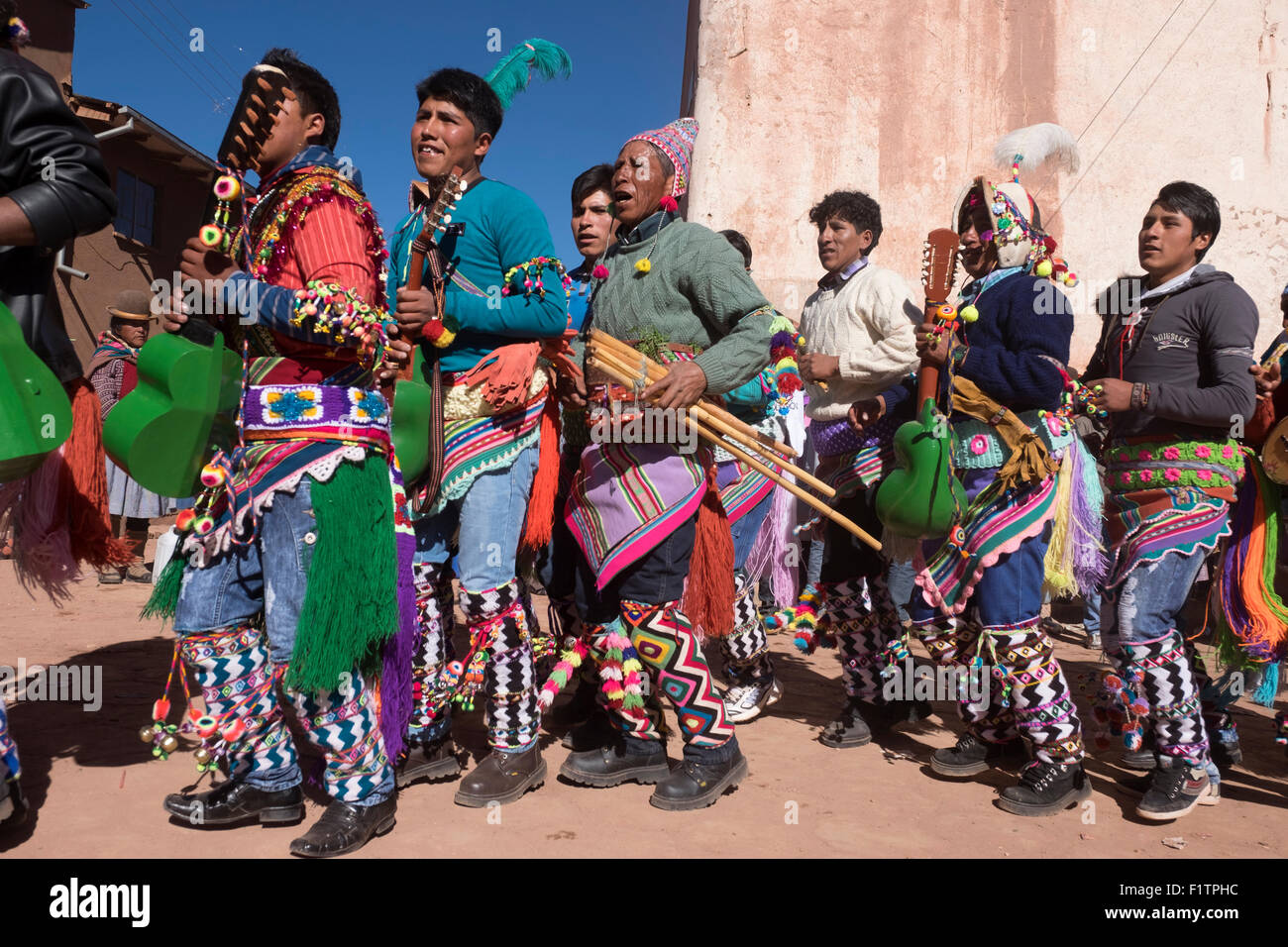 Groups of men dance and play their traditional Andean instruments Stock ...