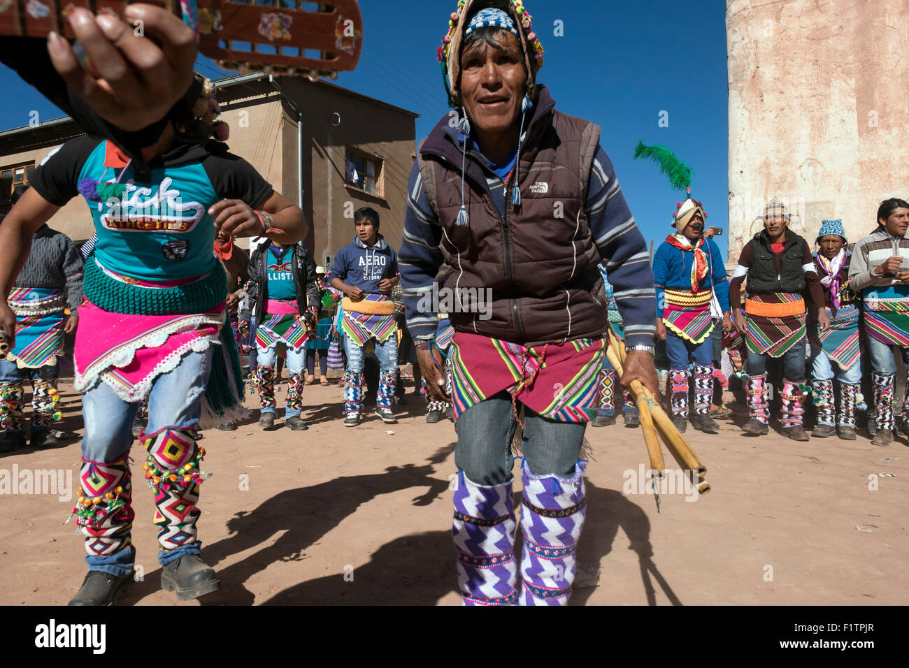 Groups of men dance and play their traditional Andean instruments Stock ...
