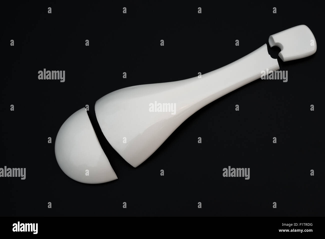 top view broken porcelain spoon on a black background Stock Photo - Alamy
