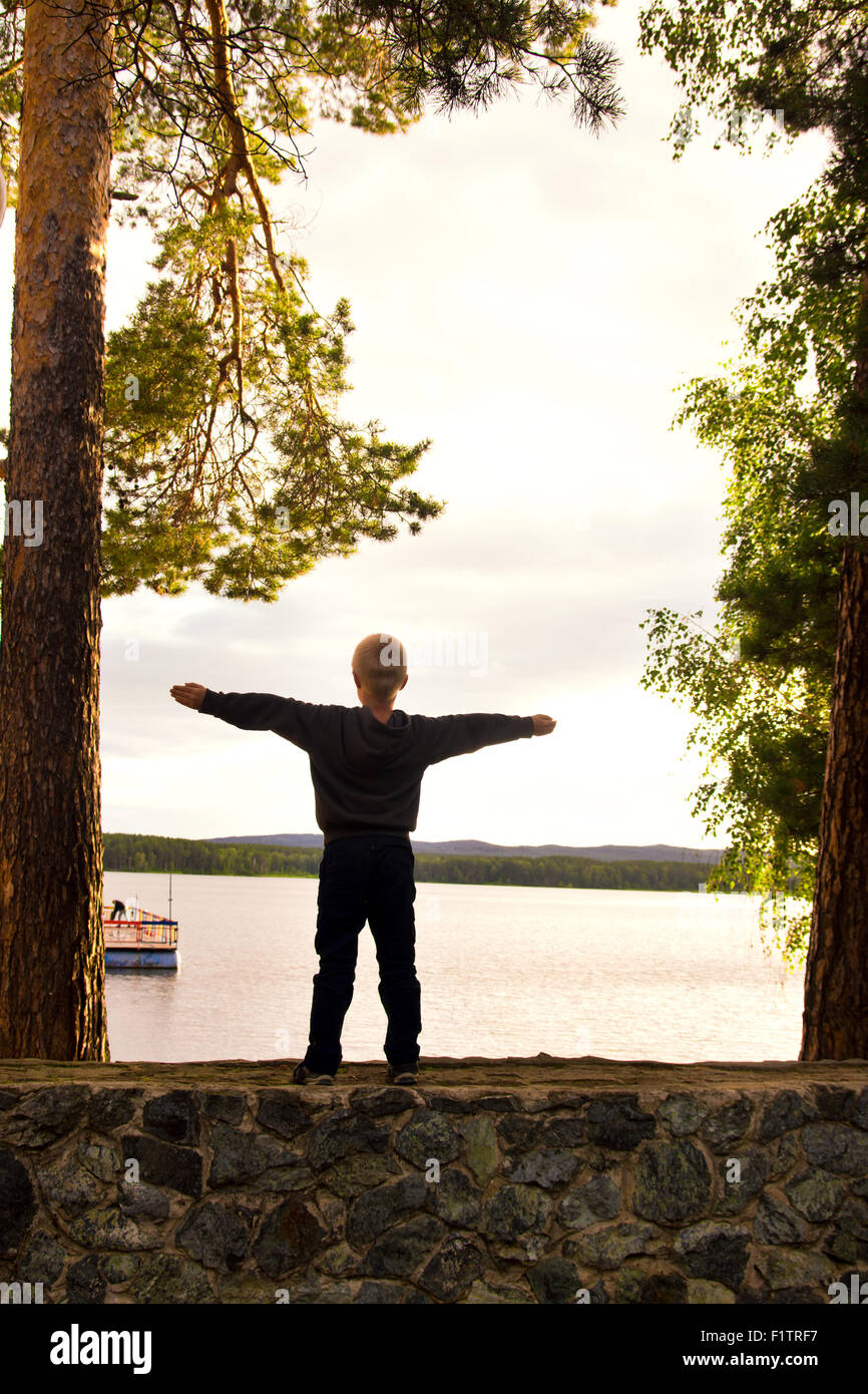 Child practice fitness and open hands outdoor, freedom concept Stock ...