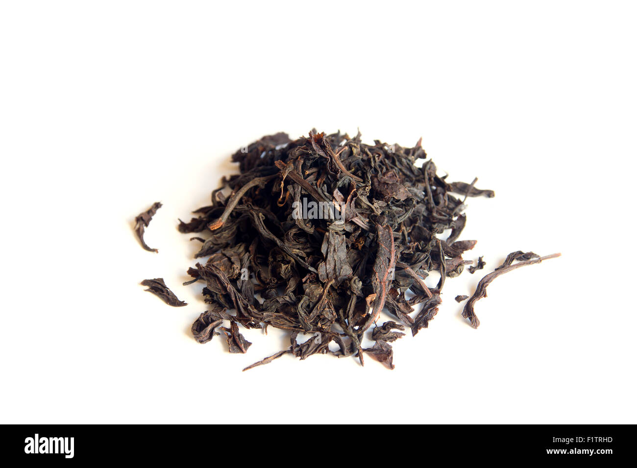 Pile of dry black tea isolated on white background Stock Photo - Alamy