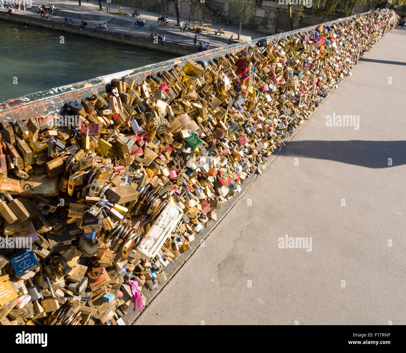Locks over the Seine. Thousands of locks fill the sides of the bridge ...
