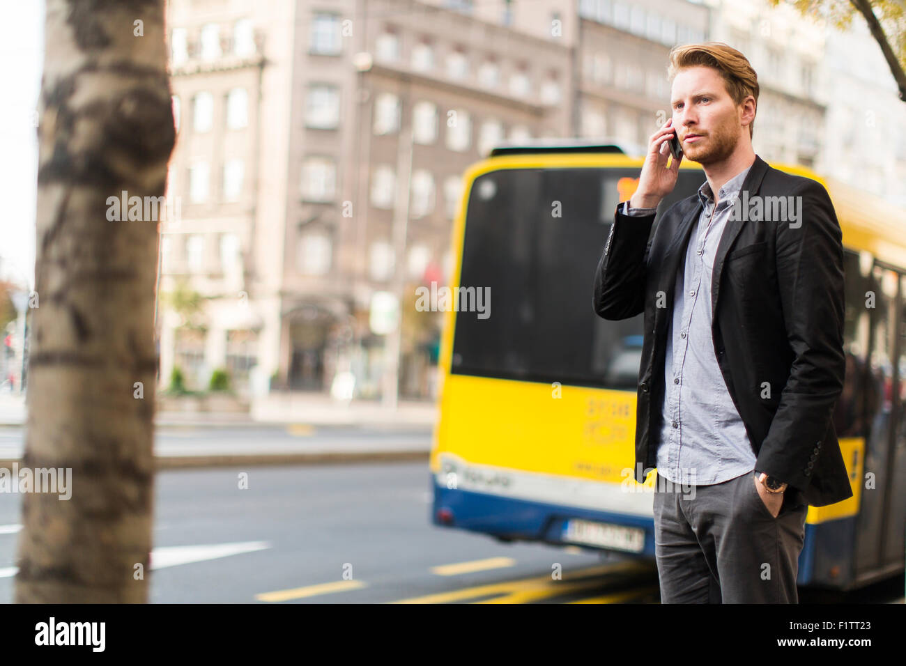 Young man on the street Stock Photo - Alamy