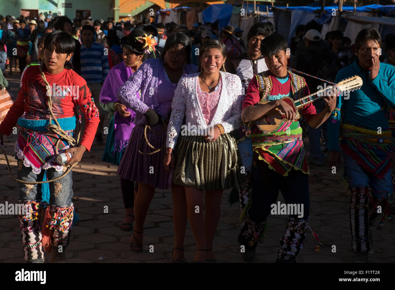 A group of participants at the celebration of the Tinku sing and play ...