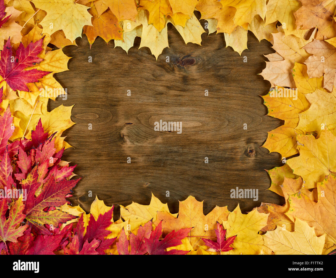 yellow autumn leaves frame on wooden background Stock Photo - Alamy