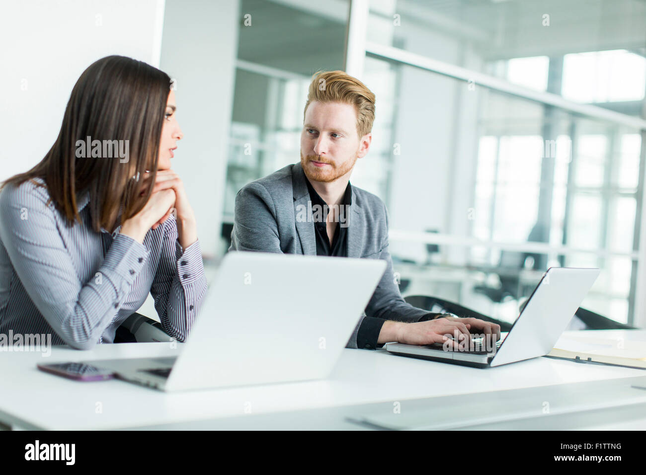 Young people in the office Stock Photo - Alamy