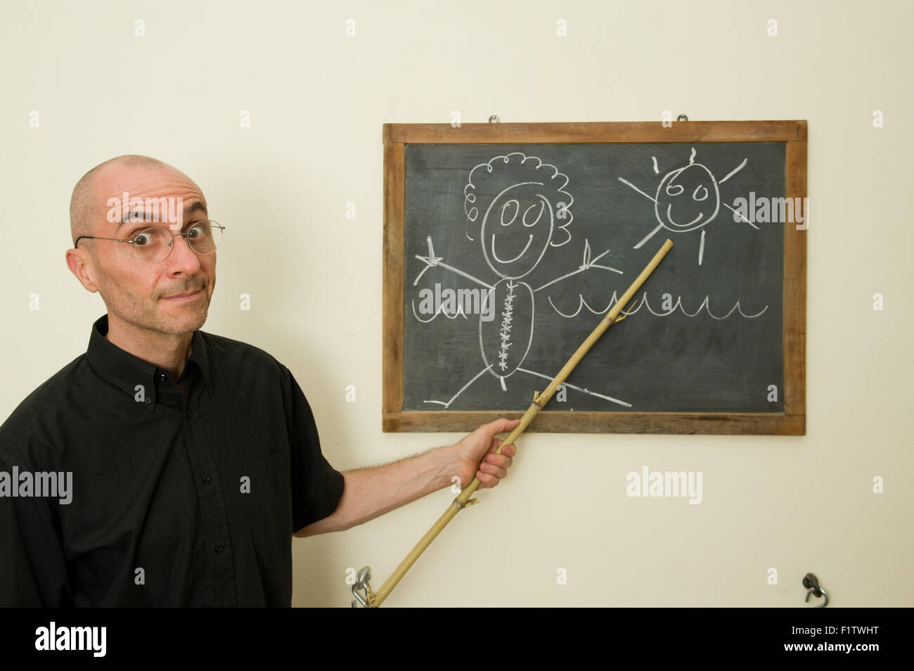 Teacher showing sketch blackboard hi-res stock photography and images ...