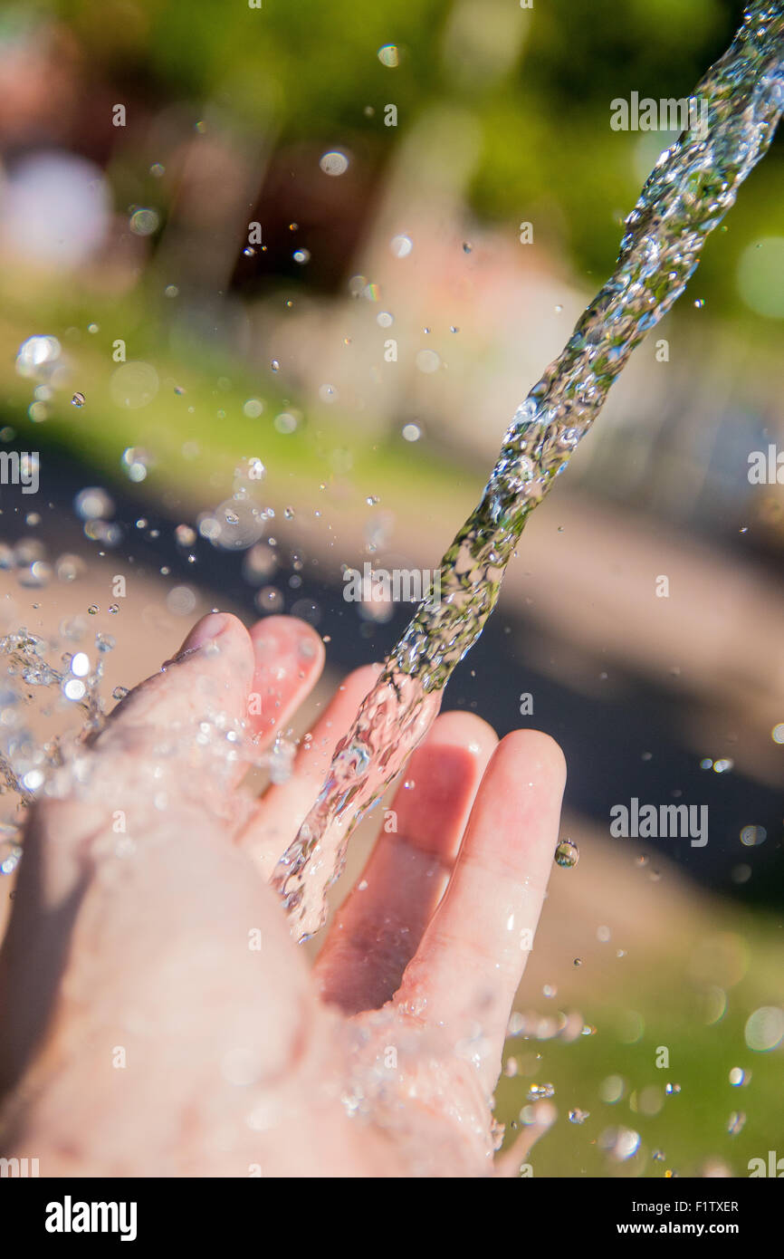 Hand touch water hi-res stock photography and images - Alamy