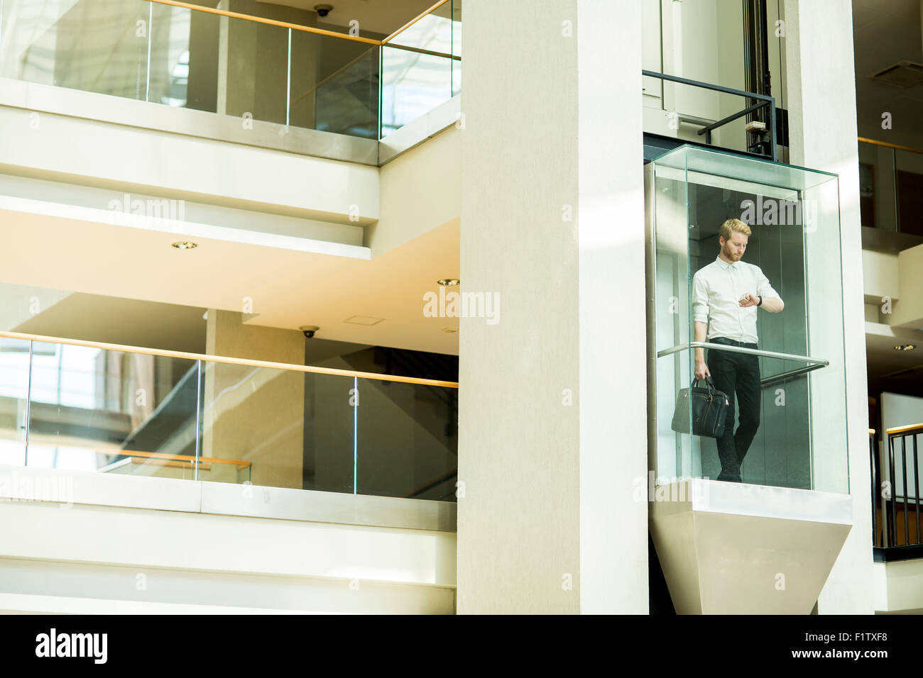 Man lift elevator hi-res stock photography and images - Alamy