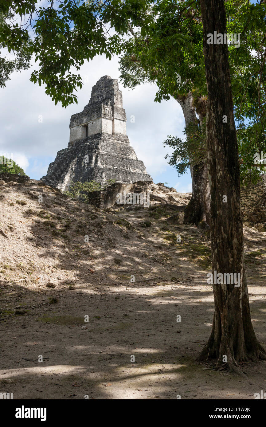 Temple I from Central Acropolis of Tikal. View from a shady spot framed ...