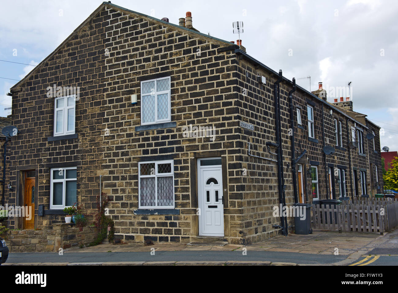 Traditional stone built houses and main street in Rodley, Leeds, West ...