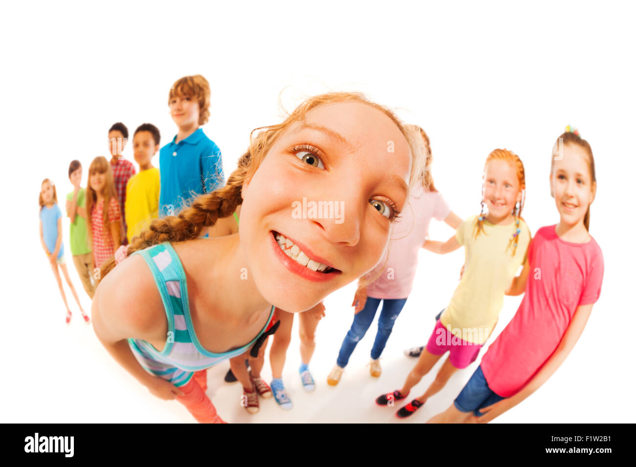 Curious funny girl in large group of friends Stock Photo - Alamy