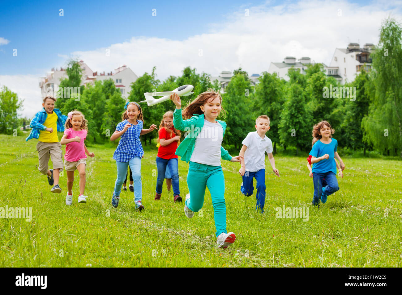 Then running behind her friends hi-res stock photography and images - Alamy