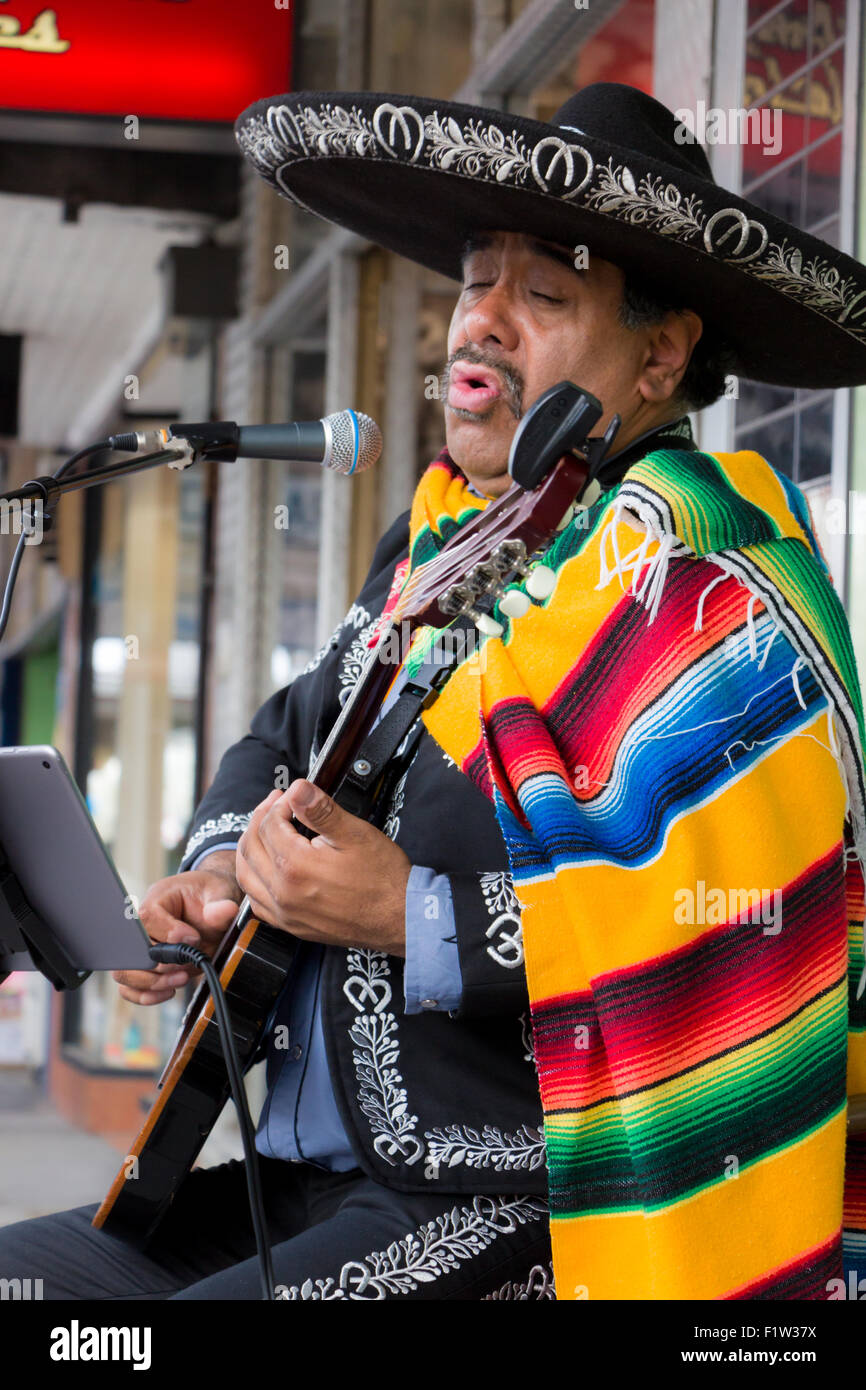 A live performer playing Mexican music on the street Stock Photo - Alamy