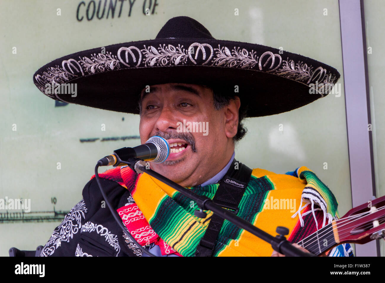A live performer playing Mexican music on the street Stock Photo - Alamy