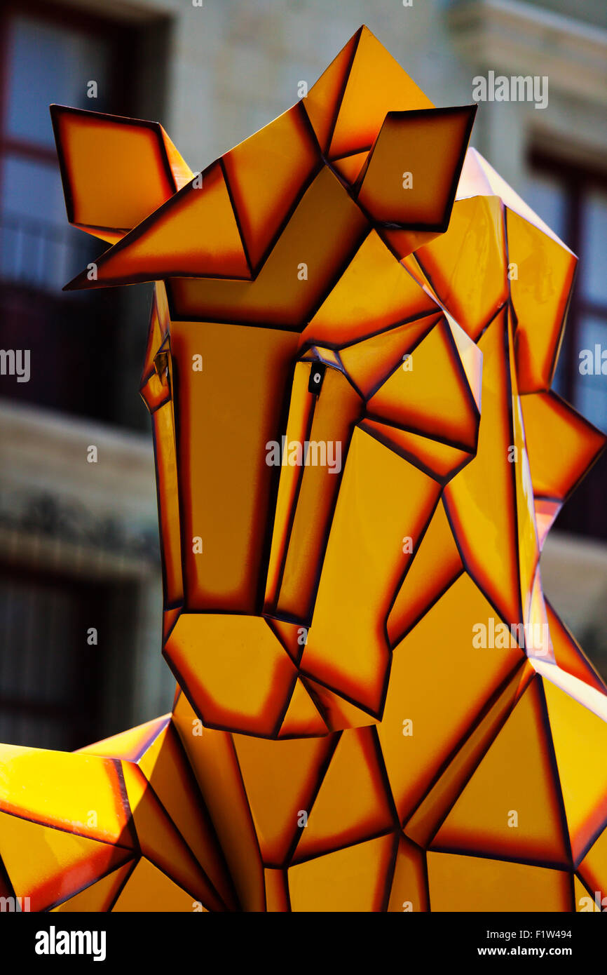 A YELLOW HORSE SCULPTURE by FERNANDO ANDRIACCI on display in front of ...