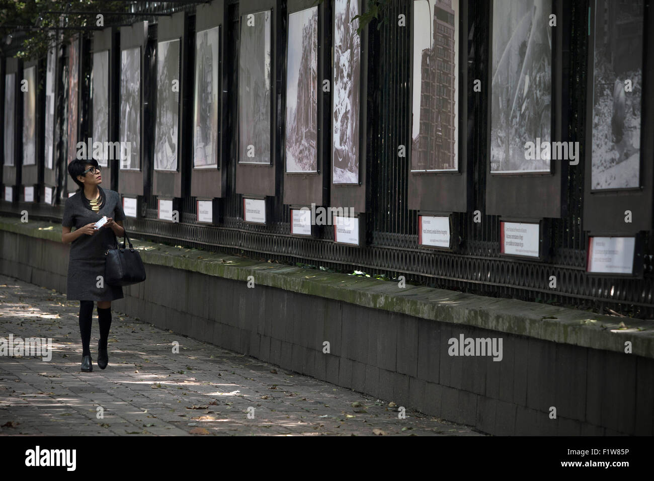 Mexico City, Mexico. 7th Sep, 2015. A woman watches a photograph ...
