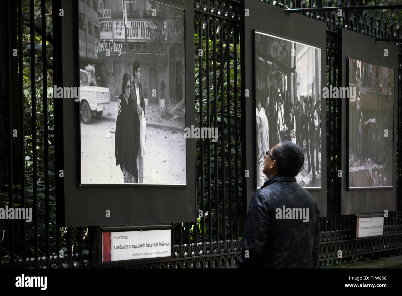 Mexico City, Mexico. 7th Sep, 2015. A man watches a photograph ...