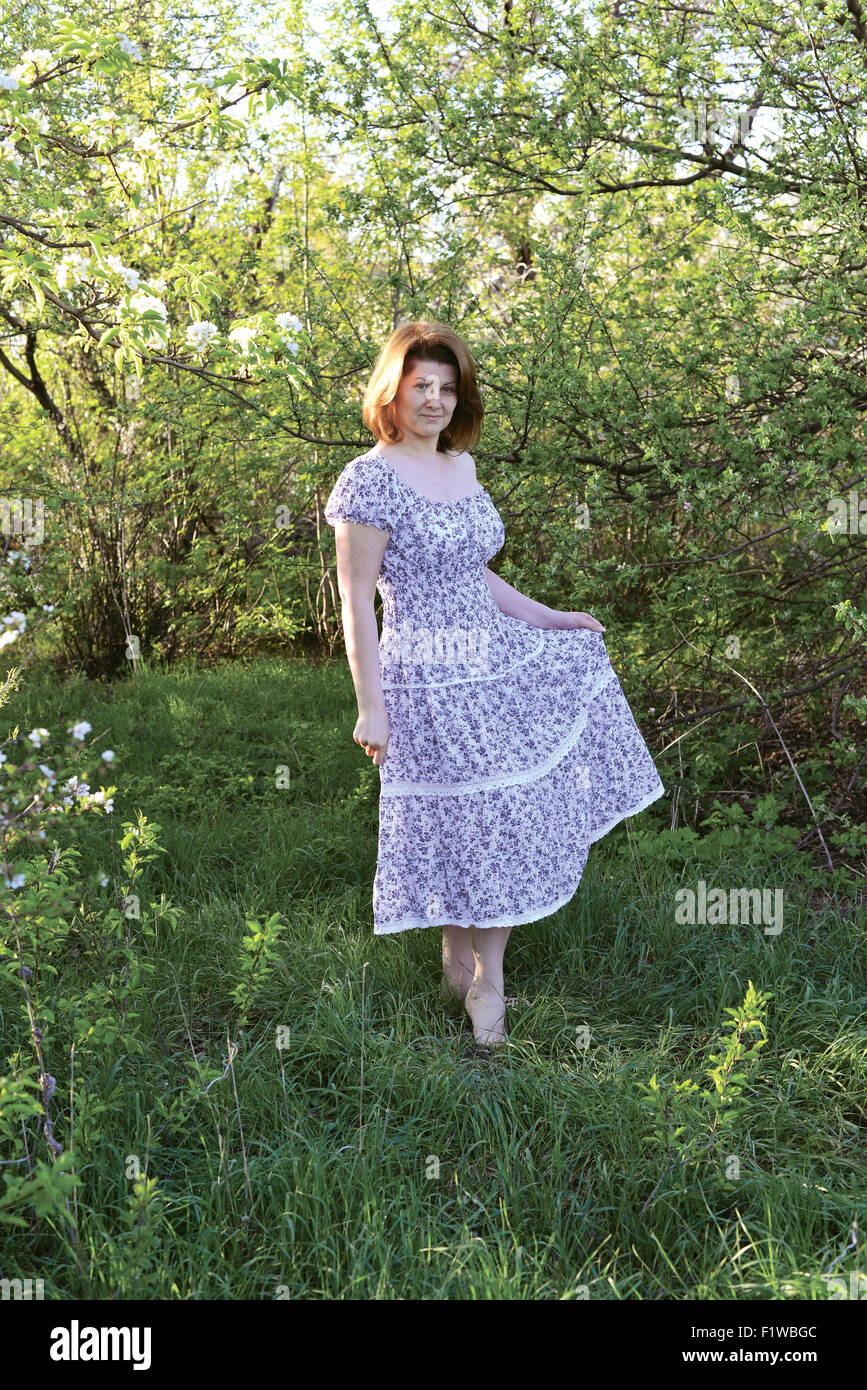 woman in apple orchard at early spring Stock Photo - Alamy