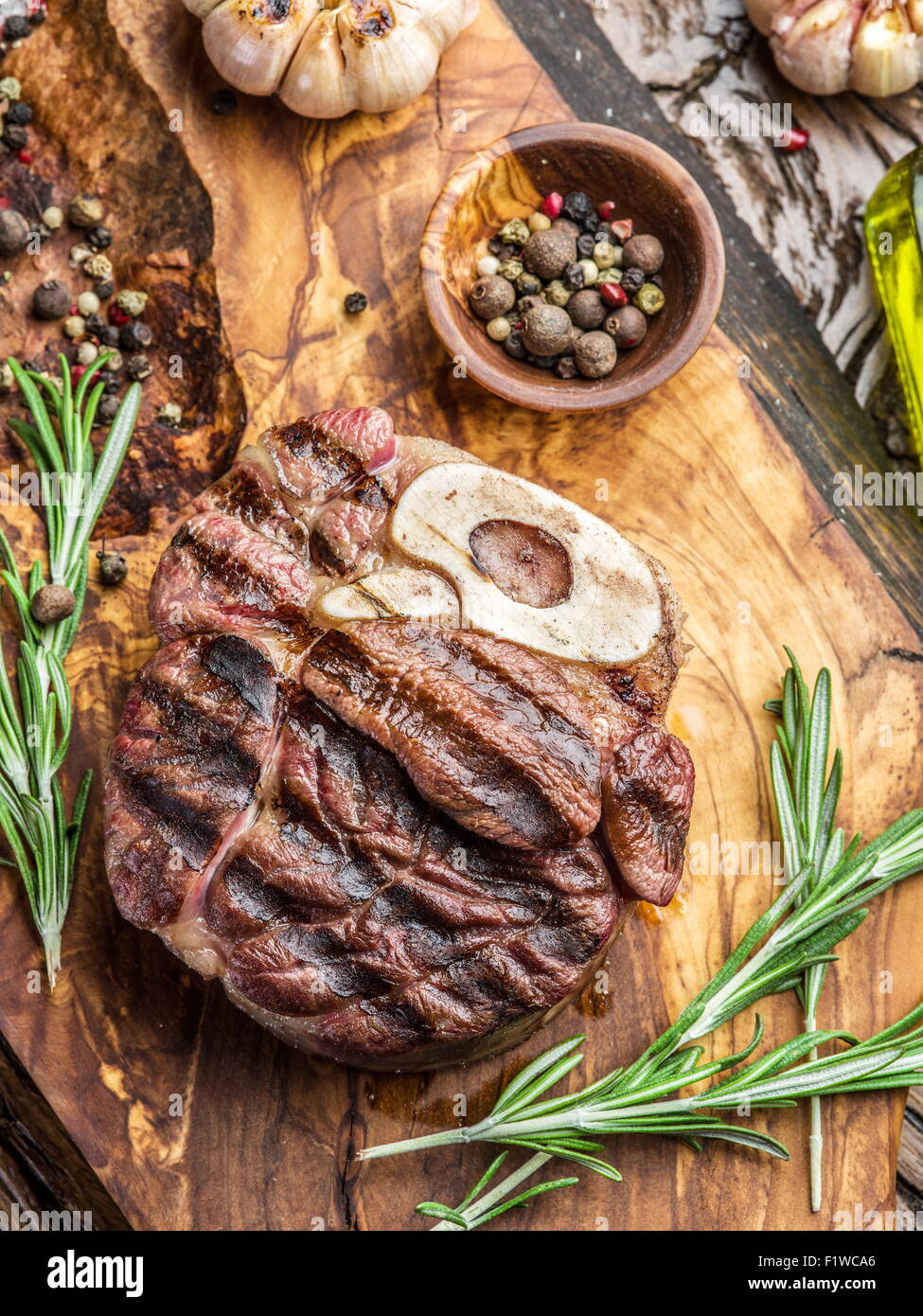 Beef steaks with spices on a wooden tray Stock Photo - Alamy