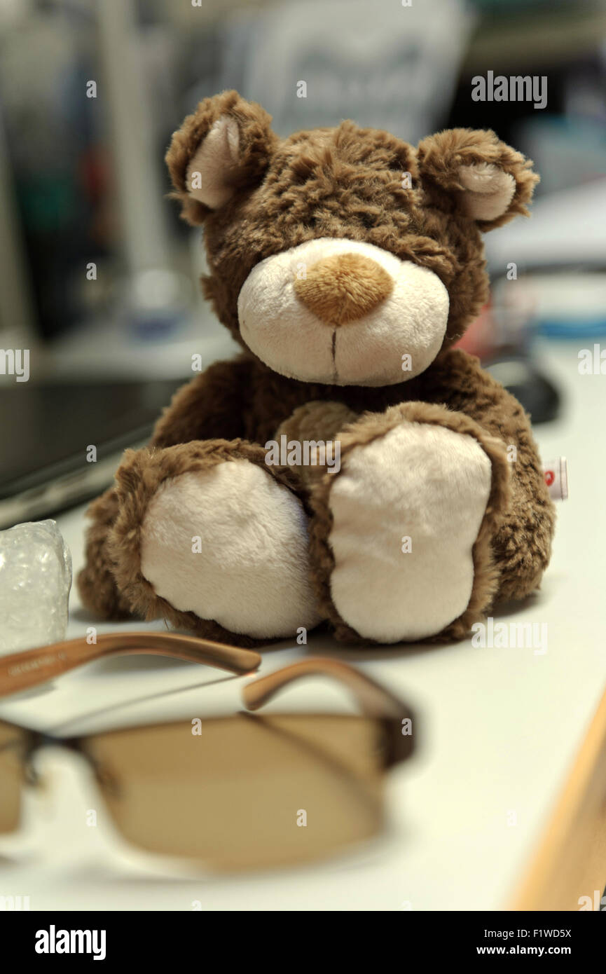 Toy teddy bear sitting on the table Stock Photo - Alamy