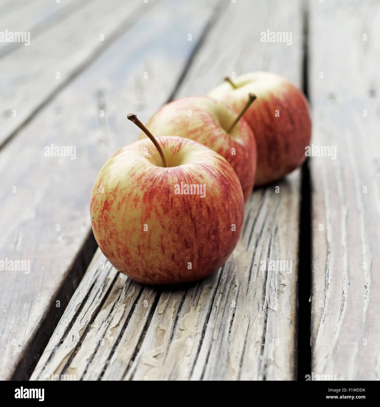 sweet apple fruit on wooden floor background Stock Photo - Alamy