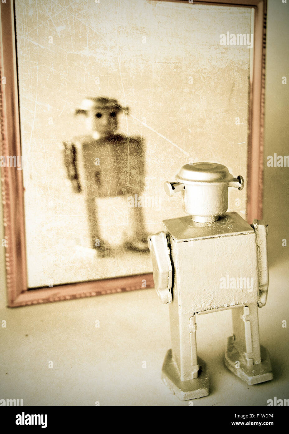 sad robot looking on the mirror Stock Photo - Alamy