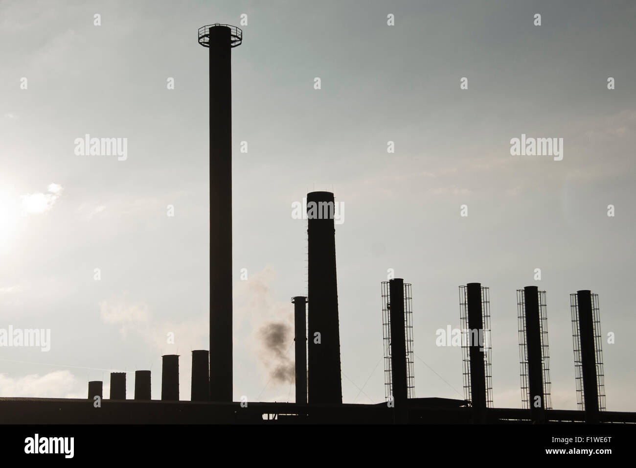 Factory silhouette pollution smokestacks hi-res stock photography and ...