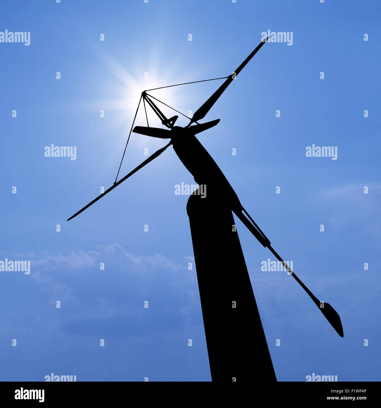 silhouette of wind turbine for renewable energy with beautiful sunlight ...