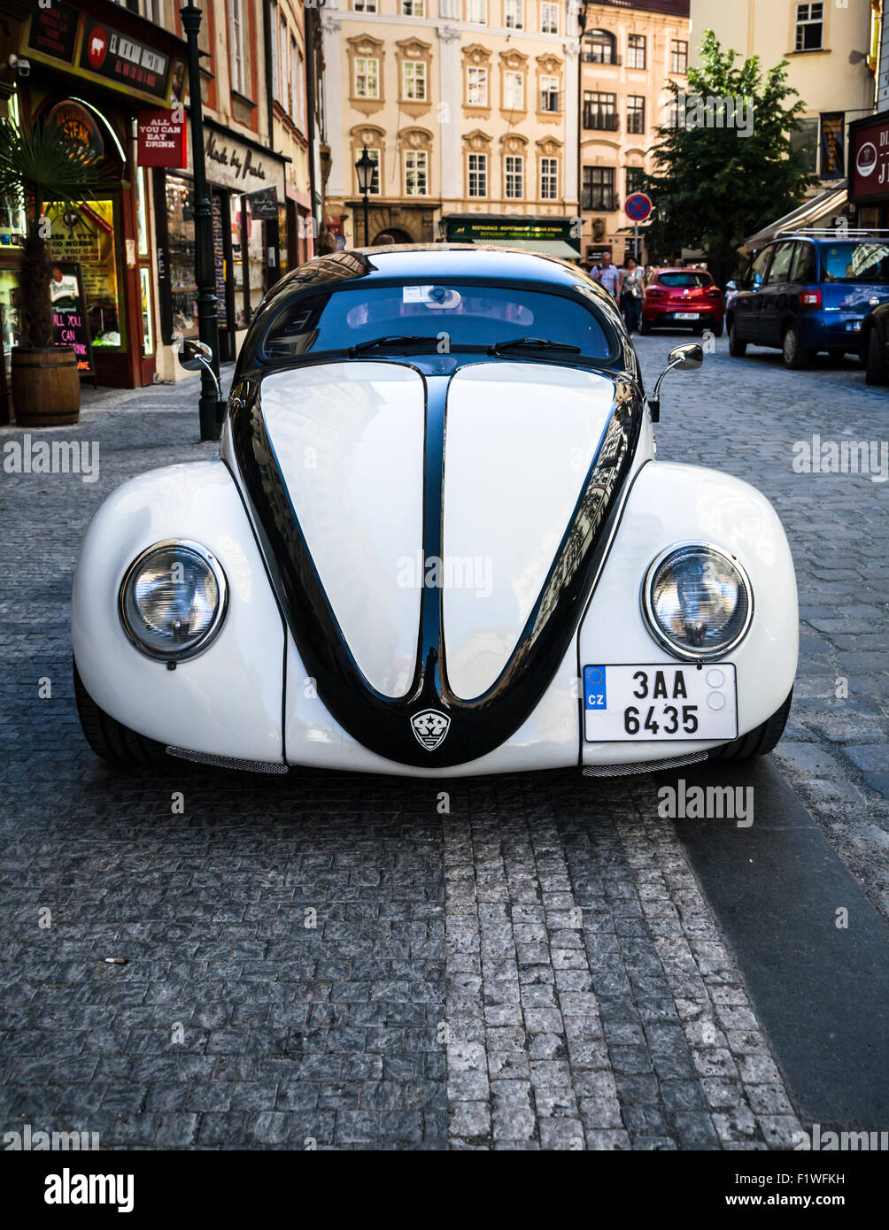 Customised old white Volkswagen Beetle parked on a Prague street, Czech ...