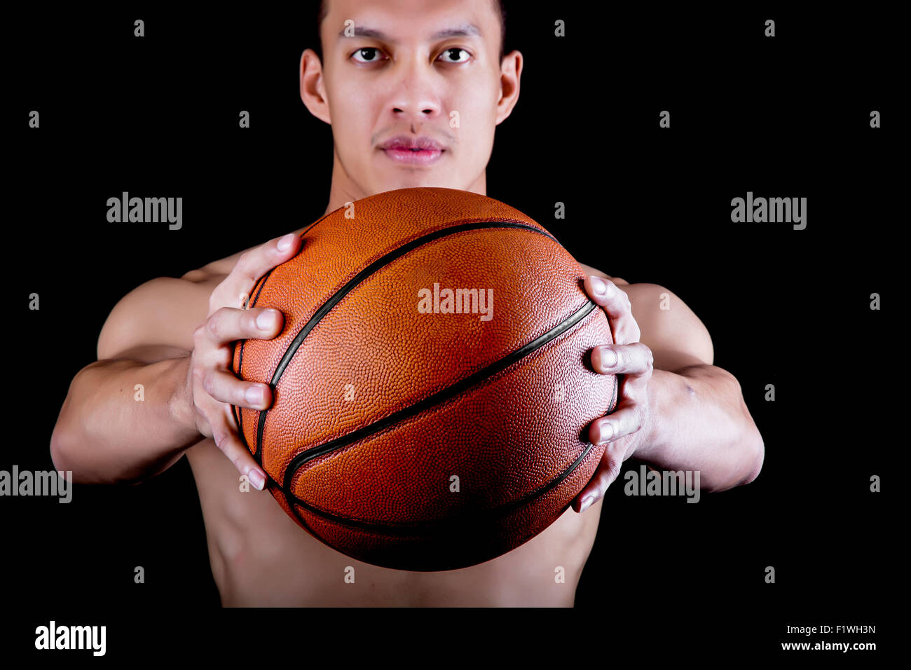 Asian young basketball player on black background Stock Photo - Alamy
