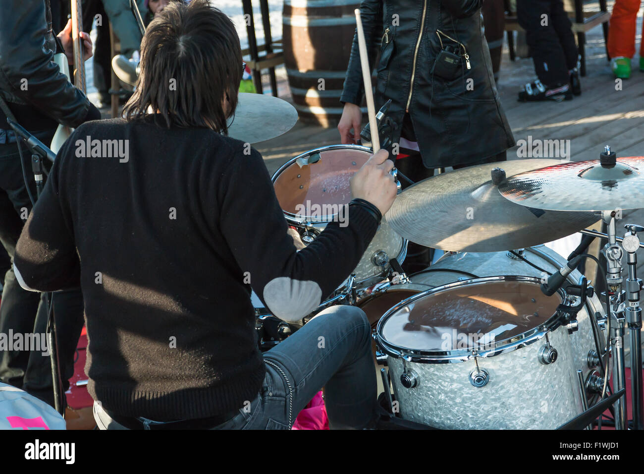 black hair drummer during outdoor concert: rear view Stock Photo - Alamy
