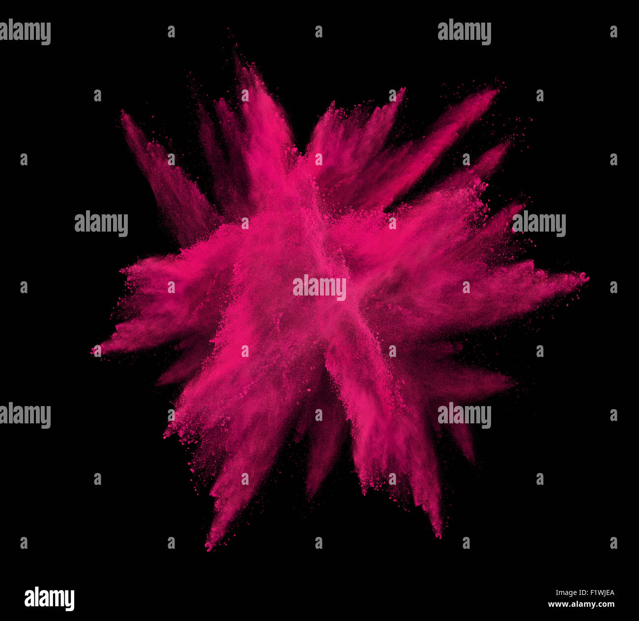 Freeze motion of red dust explosion isolated on black background Stock ...