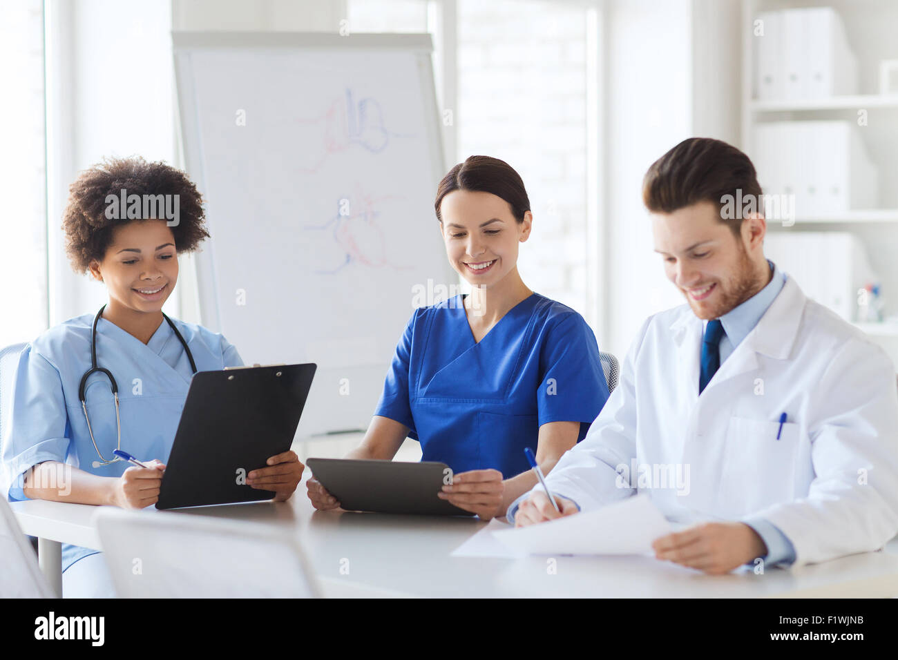 group of happy doctors meeting at hospital office Stock Photo - Alamy