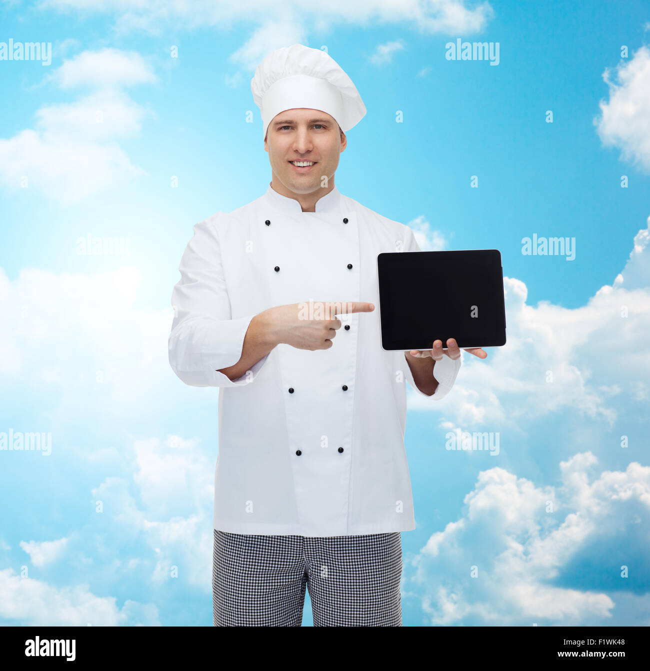 happy male chef cook showing with tablet pc Stock Photo - Alamy