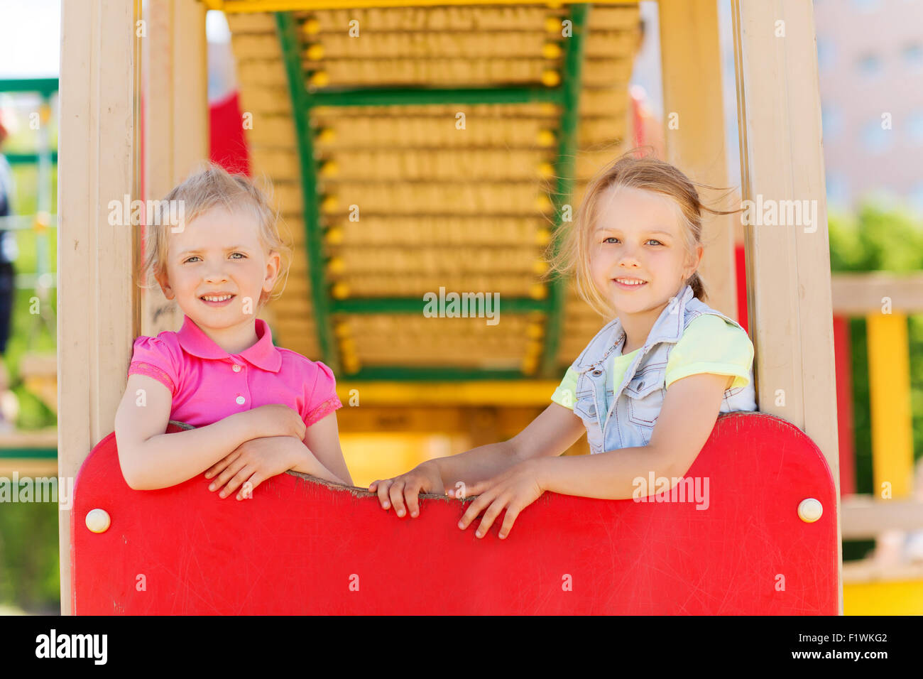 happy kids on children playground Stock Photo - Alamy