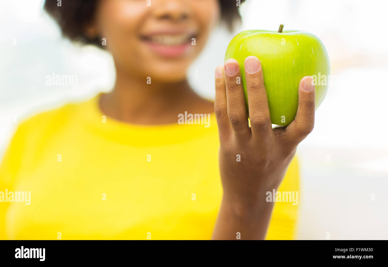 happy african american woman with green apple Stock Photo - Alamy